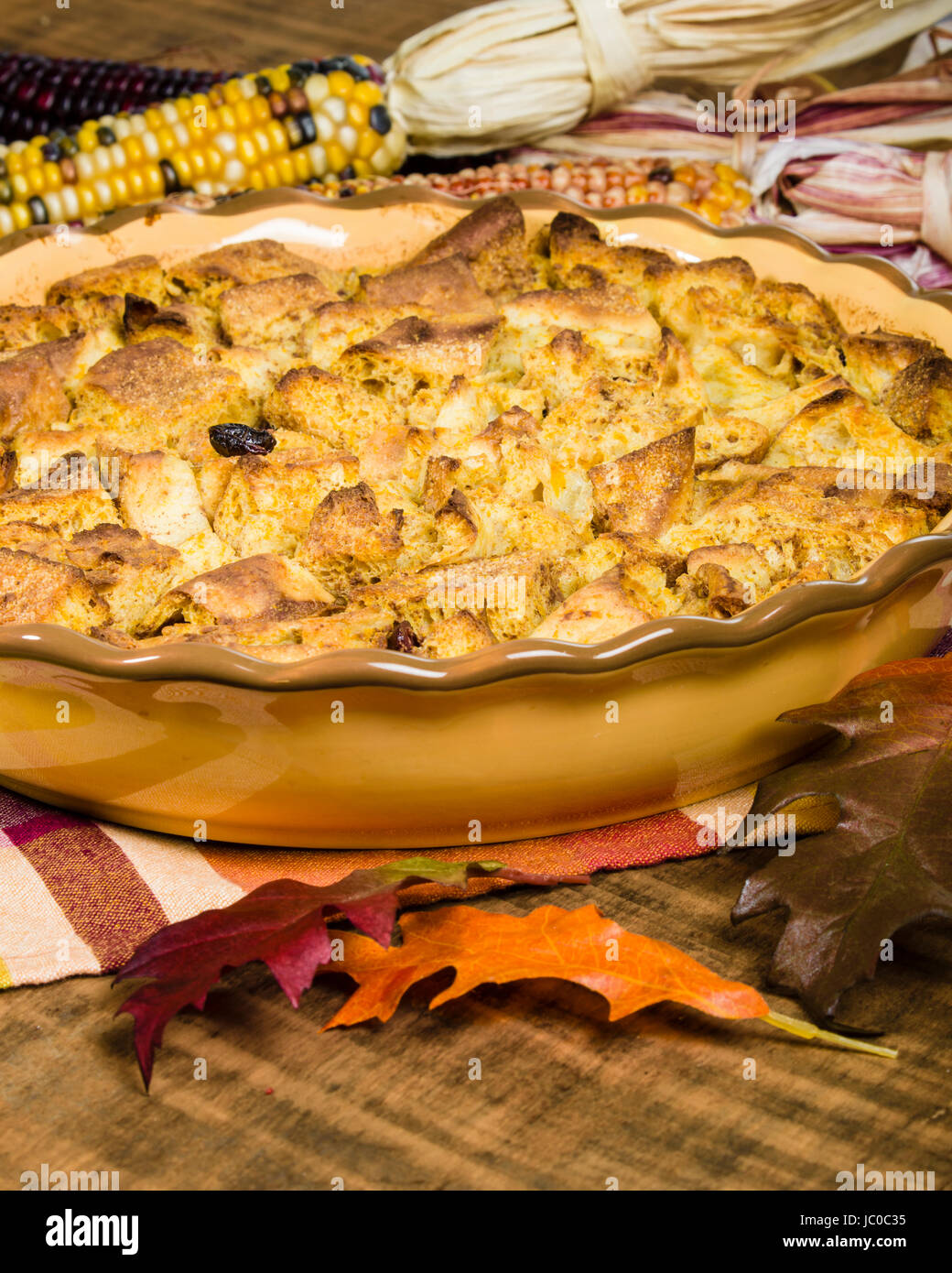 A bread pudding with raisins desert with fall or Thanksgiving ...