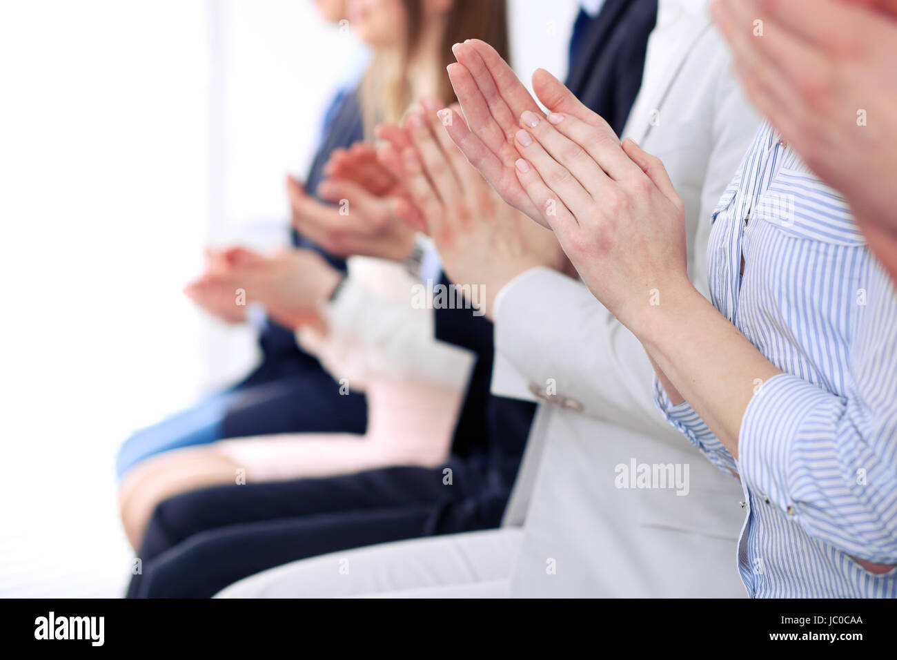 Close up of business people hands clapping at conference Stock Photo ...