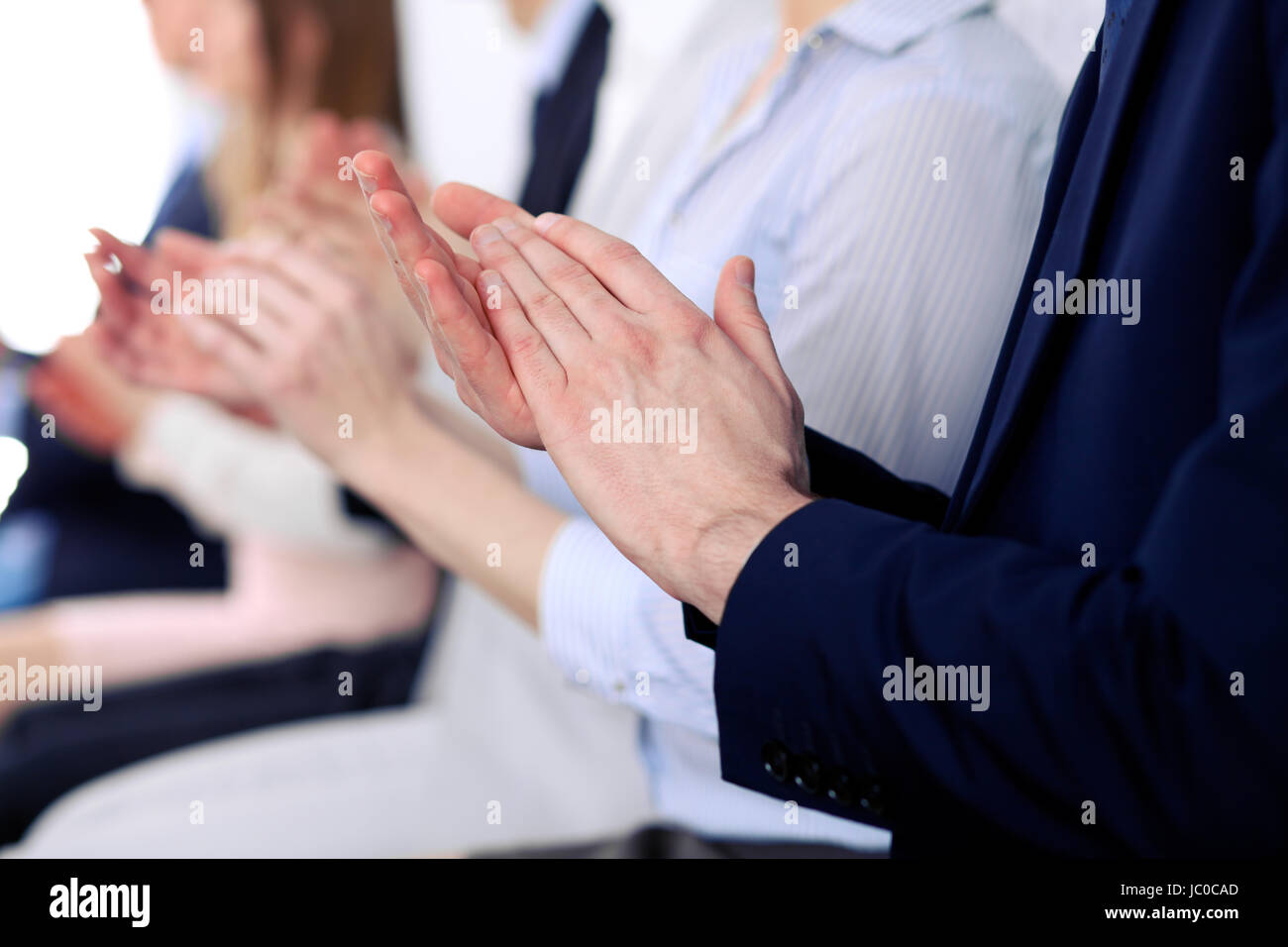 Close up of business people hands clapping at conference Stock Photo ...