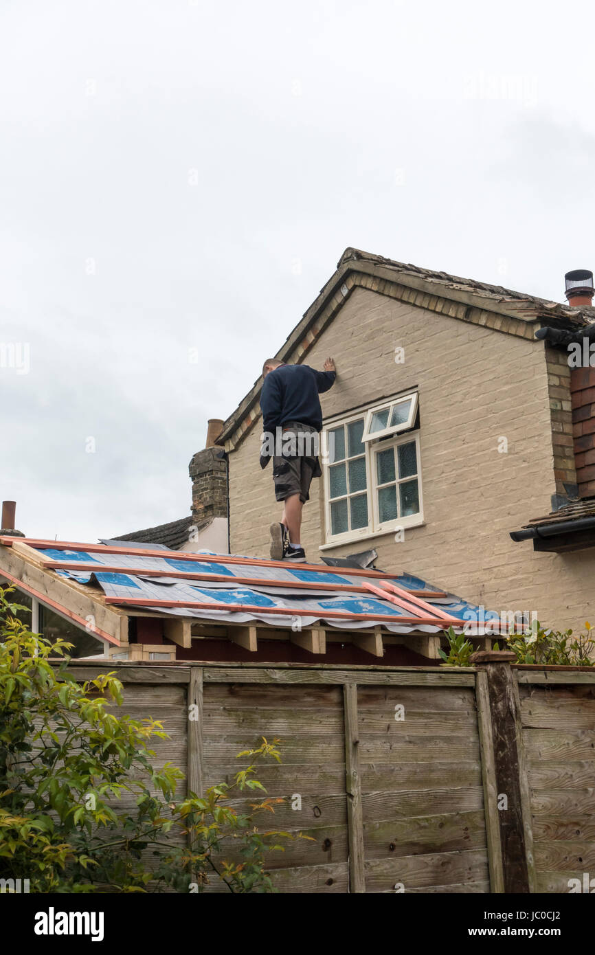 Roofer in nonchalant pose Stock Photo - Alamy