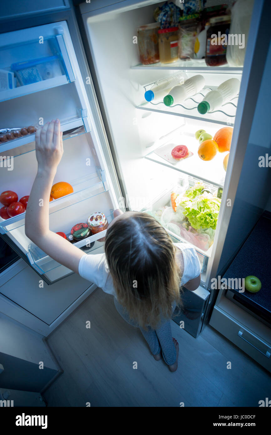 Lady reaching top shelf hi-res stock photography and images - Alamy