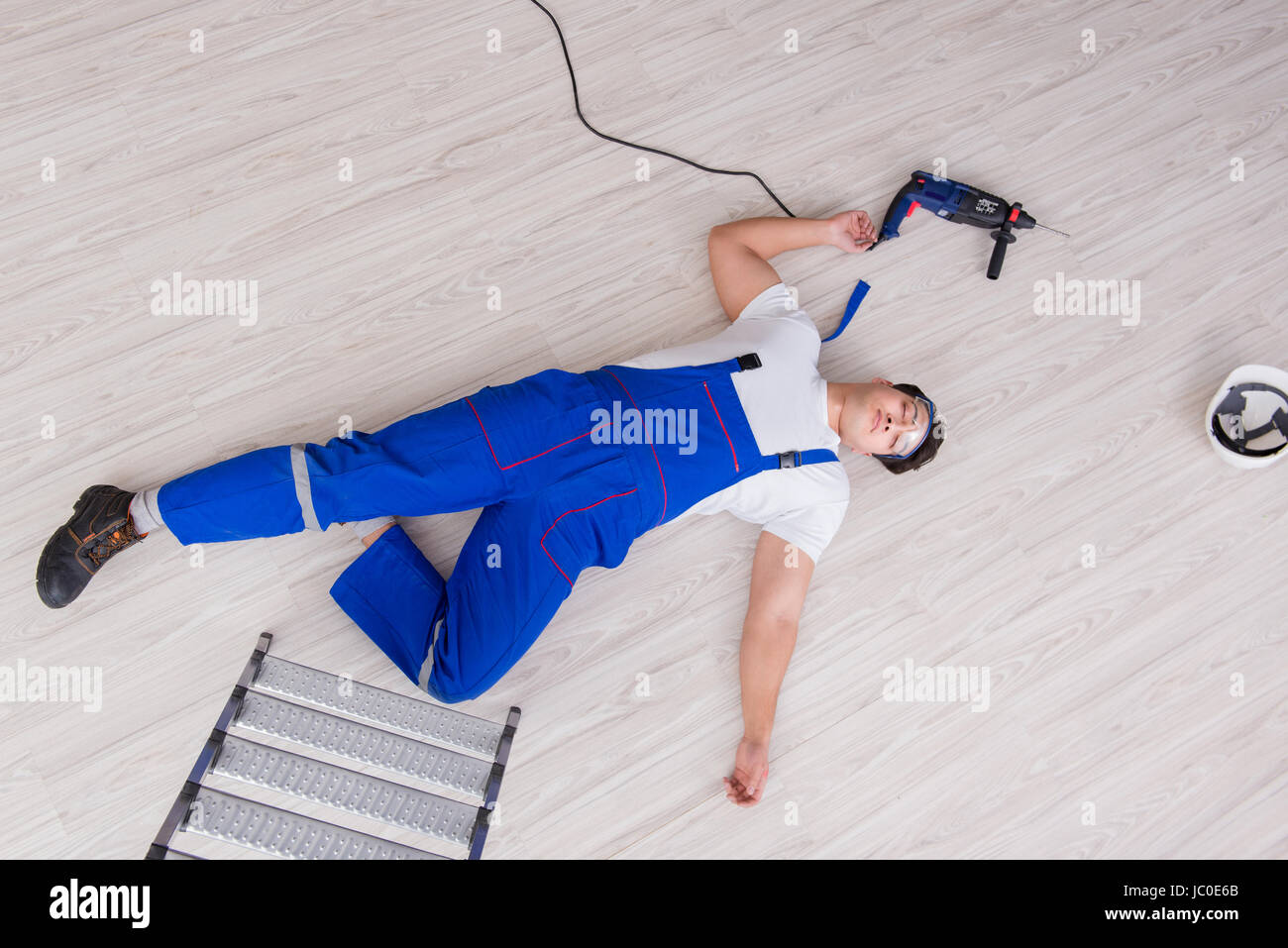 Worker after falling from height - unsafe behavior Stock Photo - Alamy