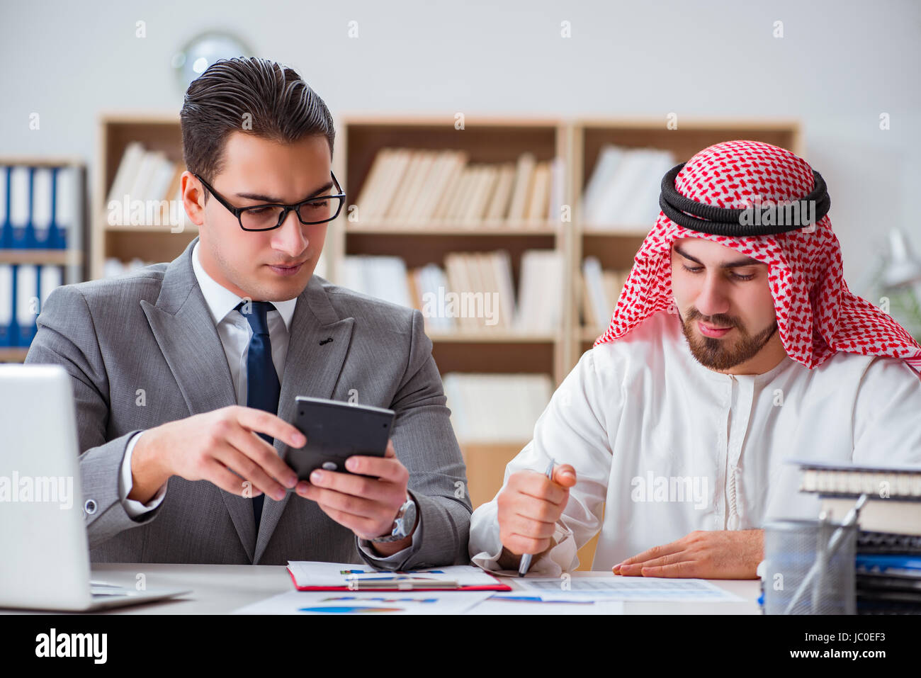 Diverse business concept with arab businessman Stock Photo - Alamy