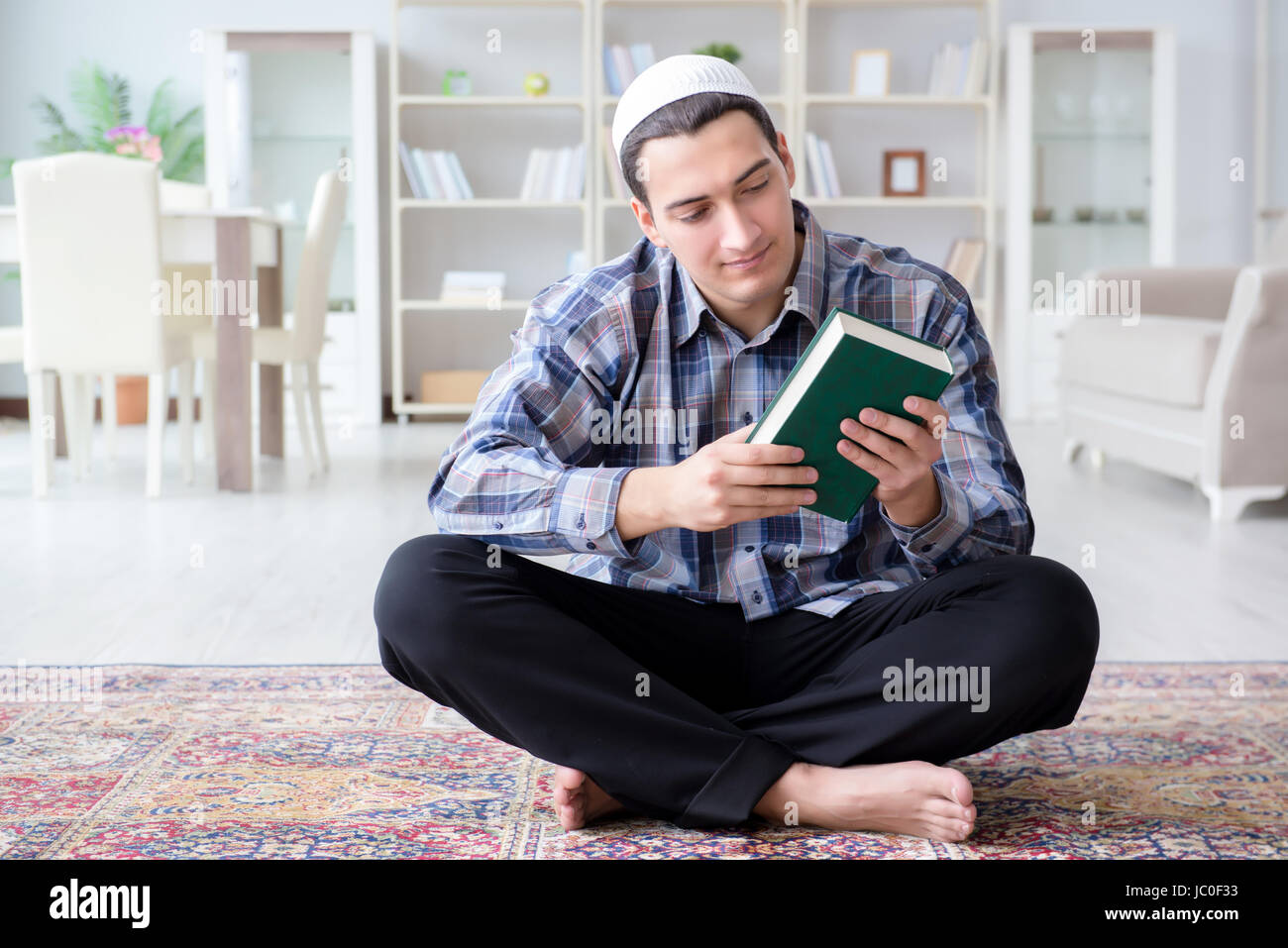 Muslim man praying at home Stock Photo - Alamy
