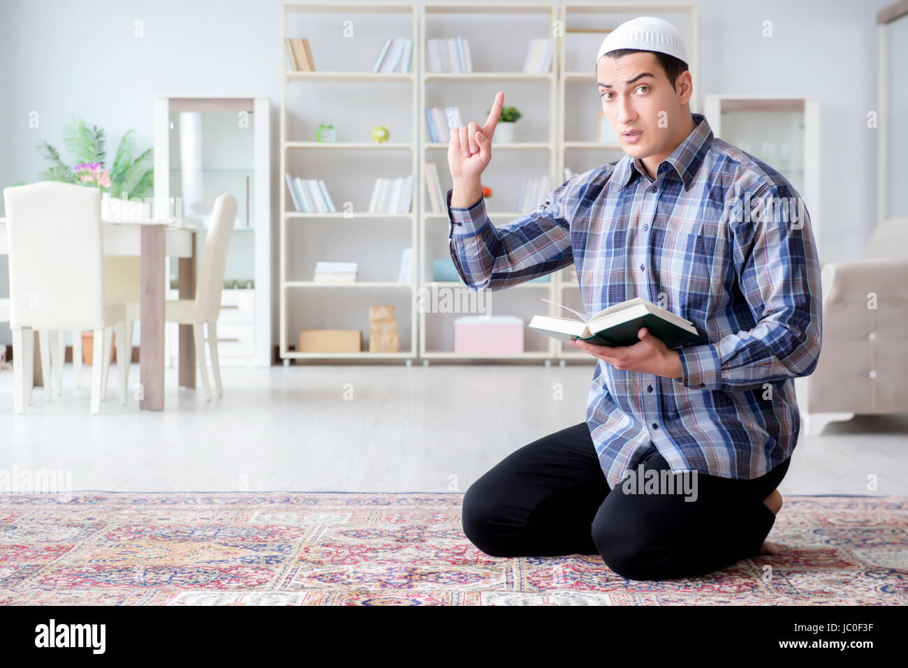 Muslim man praying at home Stock Photo - Alamy