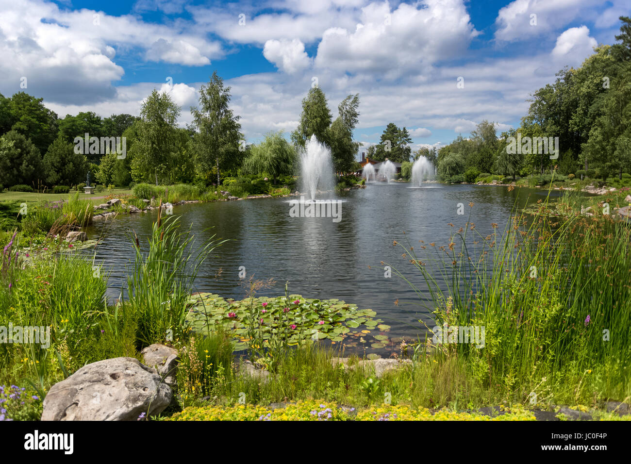Beautiful landscape of pond with fountains at park at sunny day Stock ...