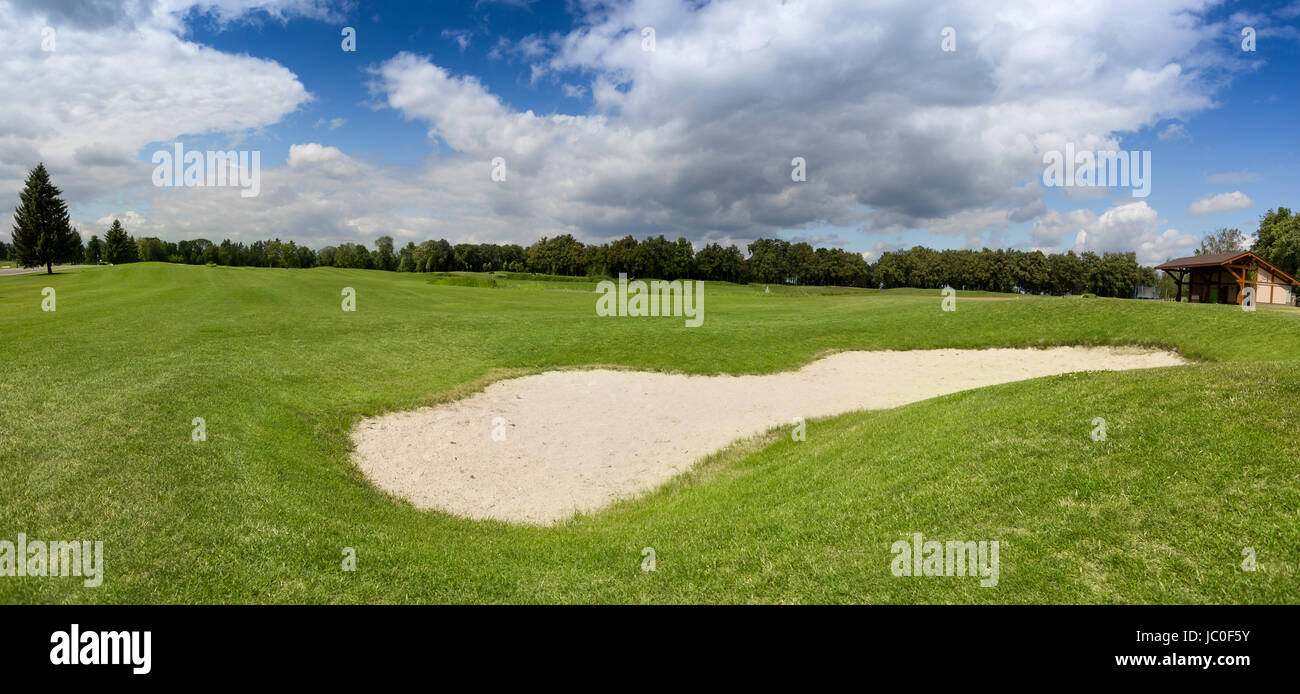 Big sand bunker on golf course with perfect green grass Stock Photo - Alamy