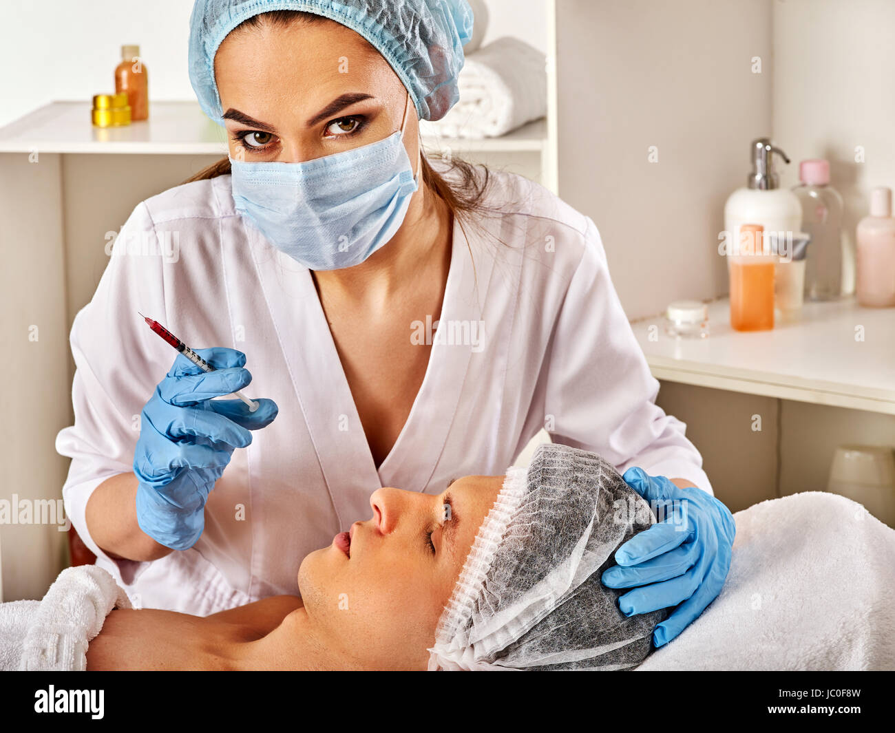 Filler injection for male forehead face. Plastic aesthetic facial ...