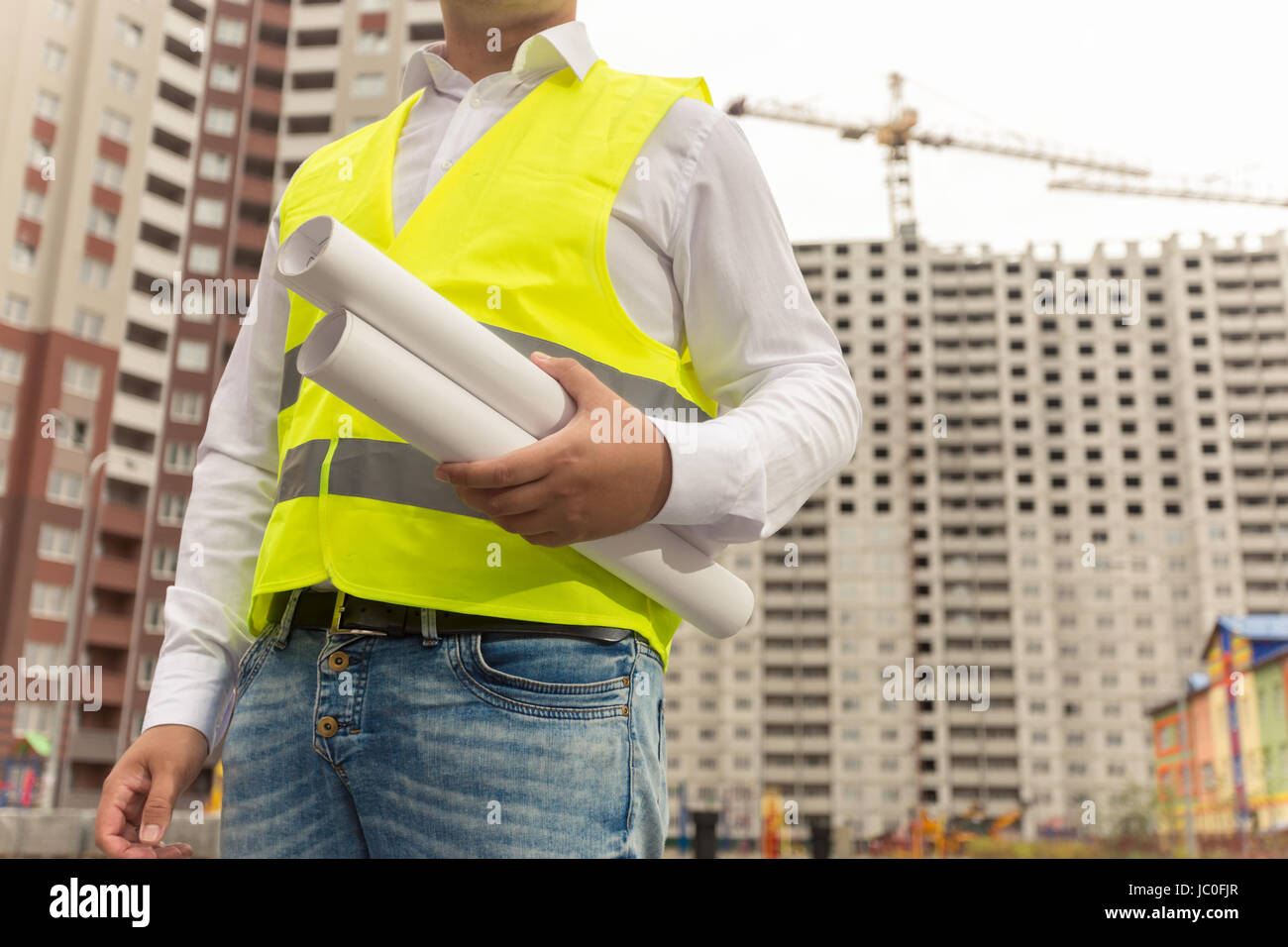 Closeup toned image of construction engineer holding blueprints Stock ...