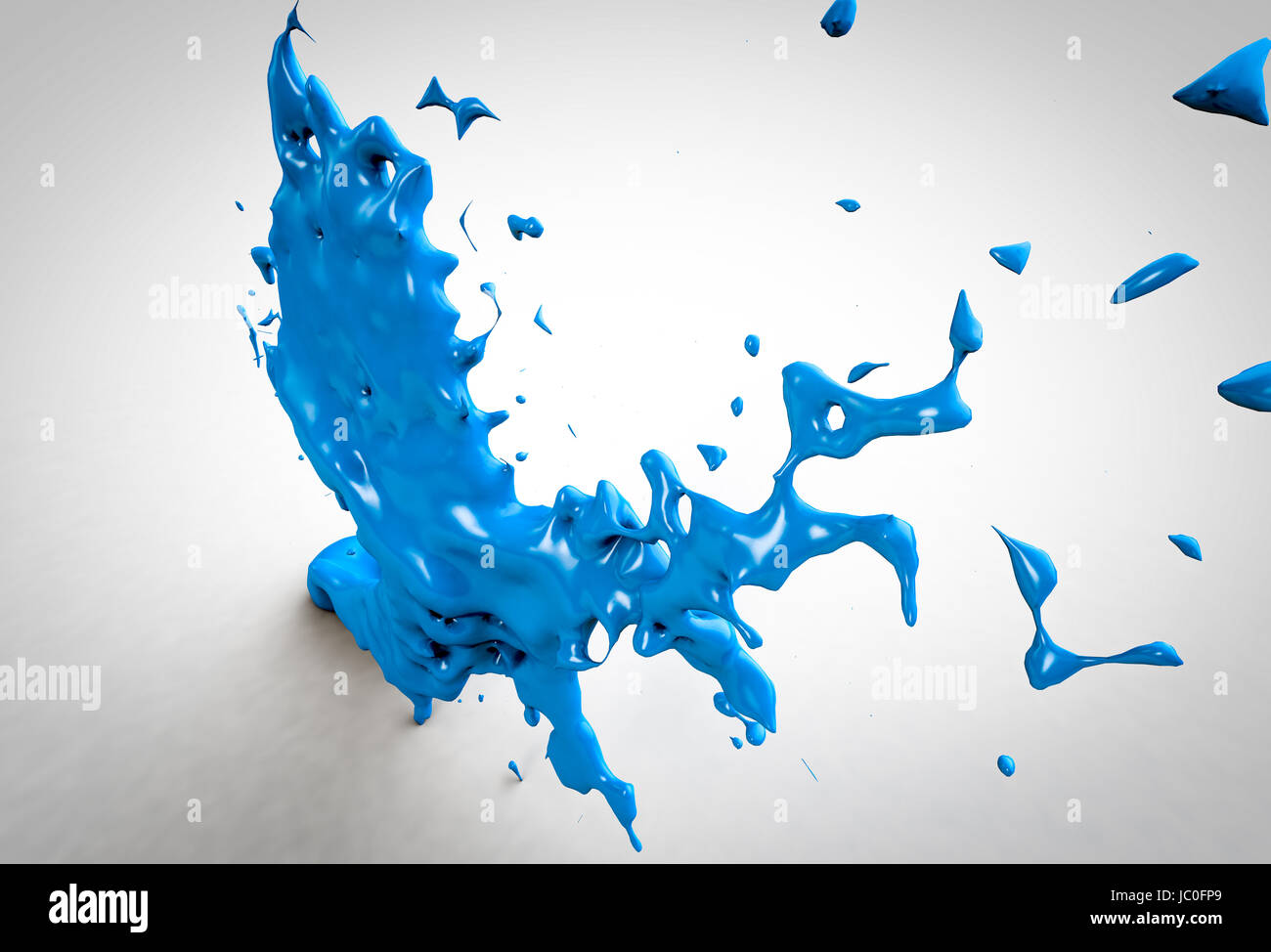 Closeup of blue paint explosion on white background Stock Photo - Alamy