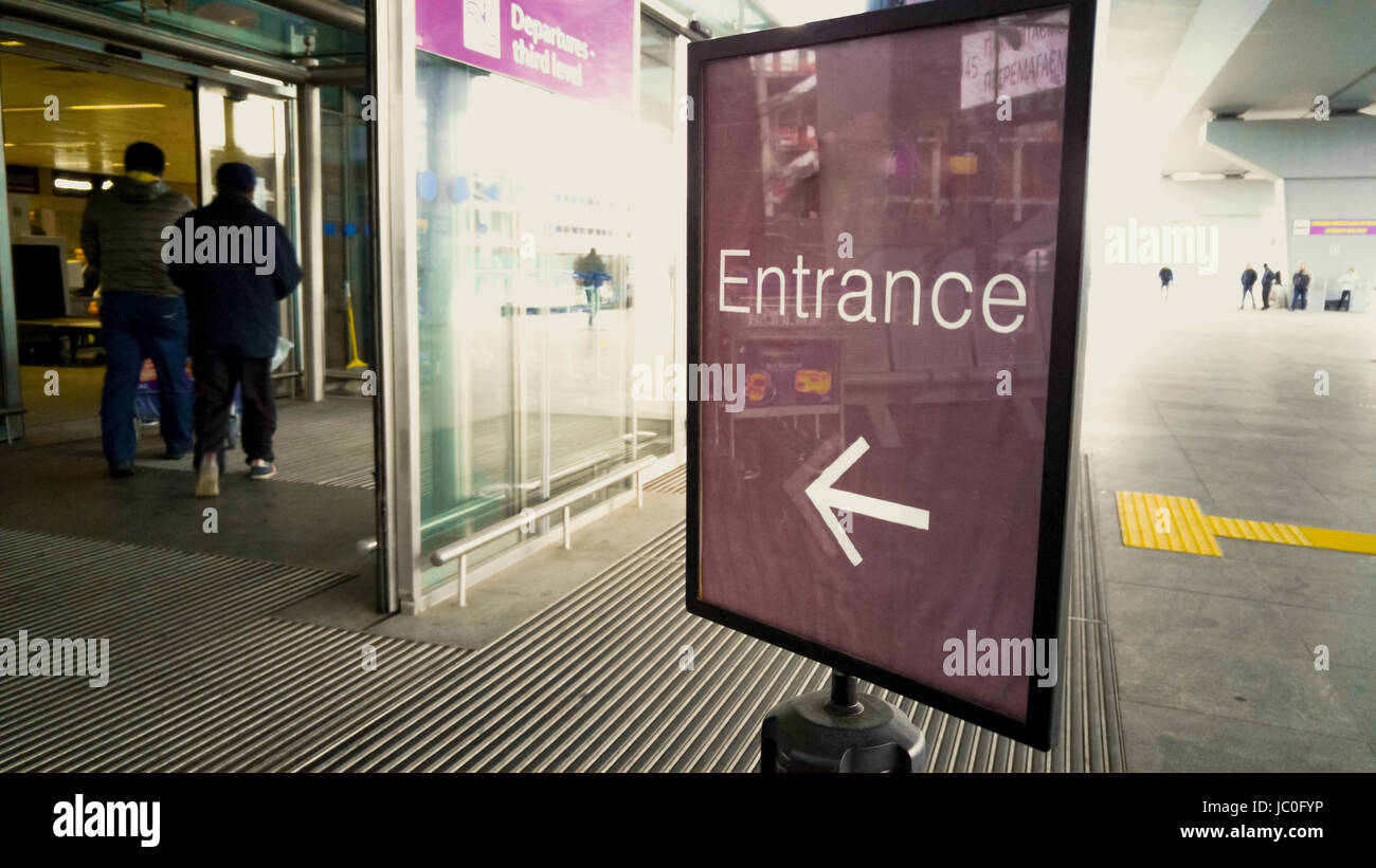Entrance sign at modern airport with automatic glass doors Stock Photo ...