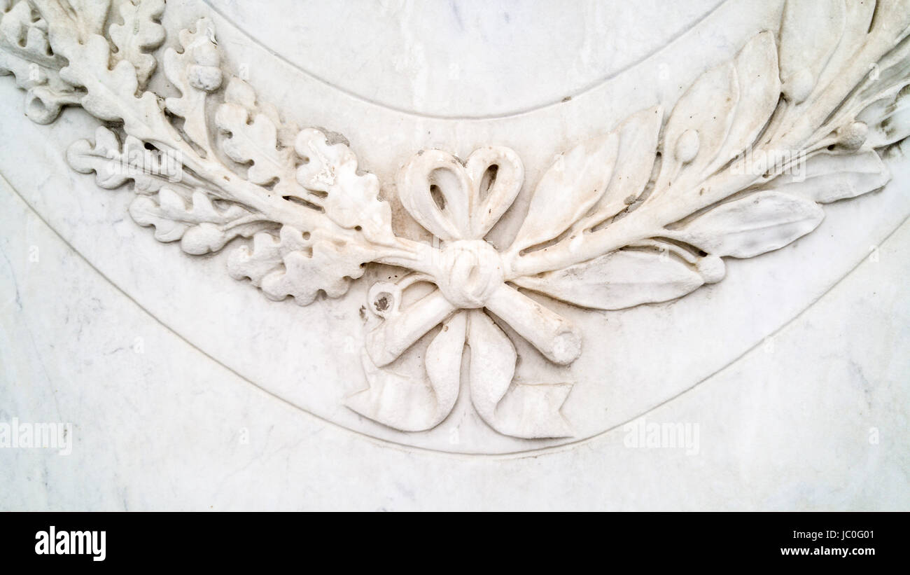 Floral design engraved on white marble stone Stock Photo - Alamy