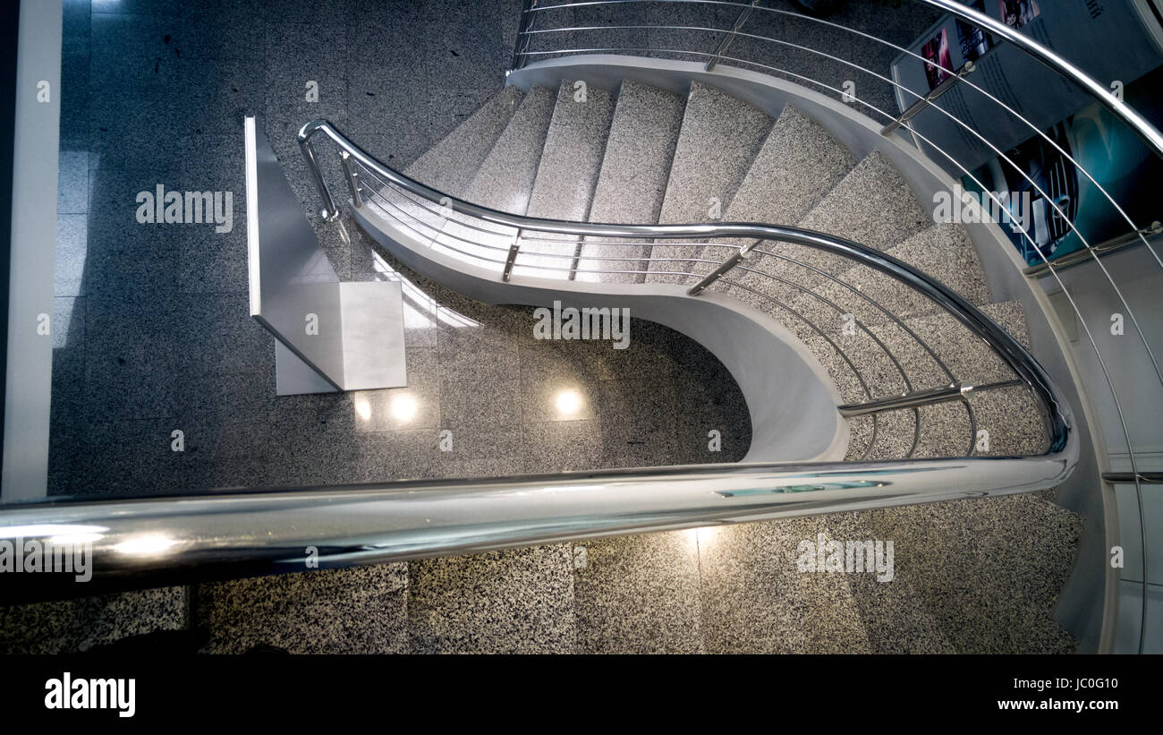 Top view on curved stone staircase at office building Stock Photo - Alamy