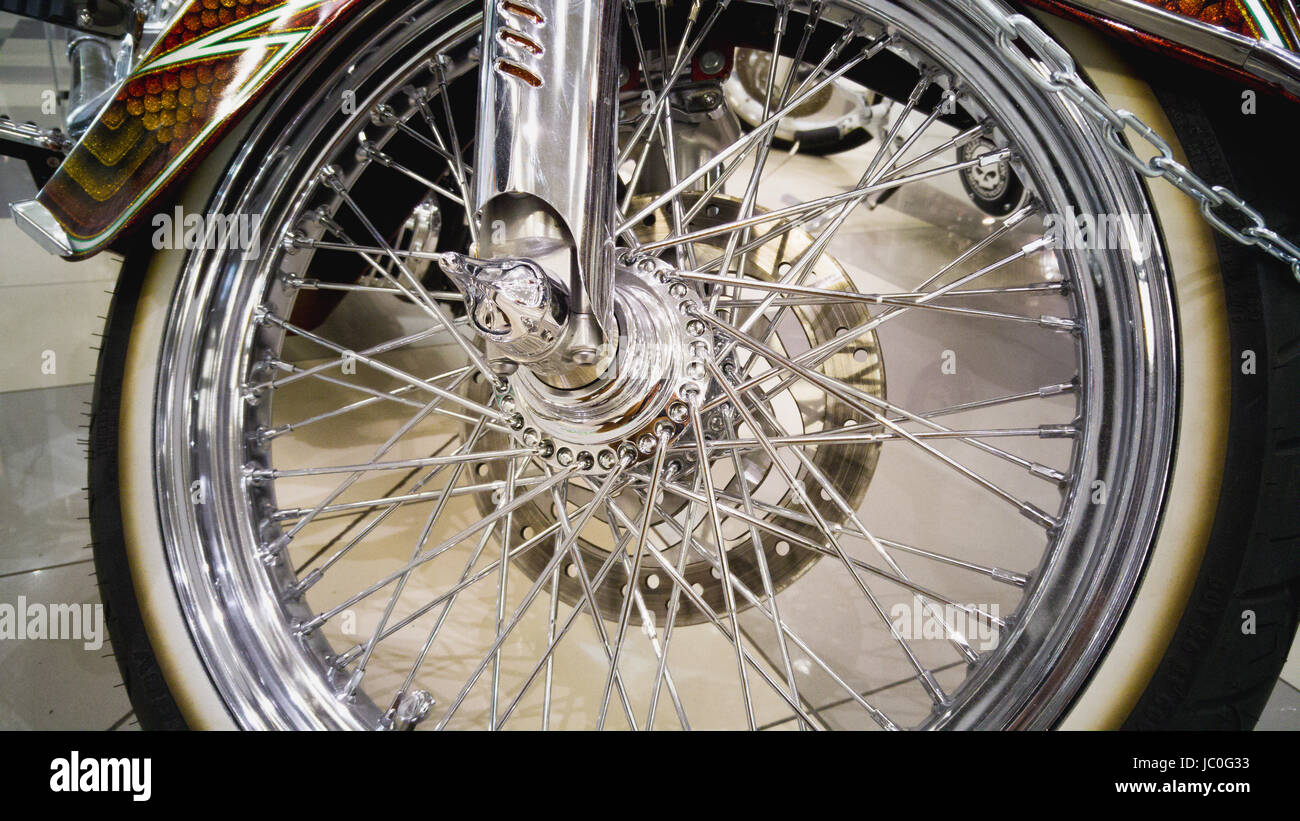 Closeup photo of chopper motorcycle chromed front wheel Stock Photo - Alamy