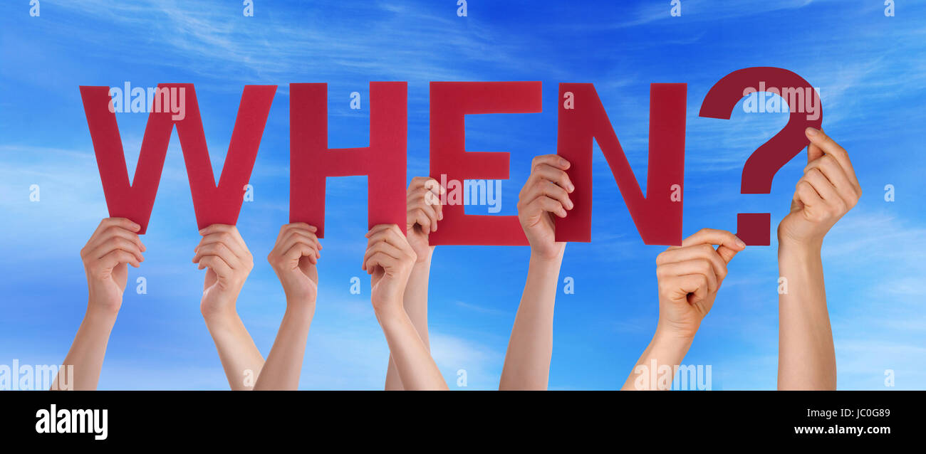 Many People Holding the Red Word When in the Sky Stock Photo - Alamy