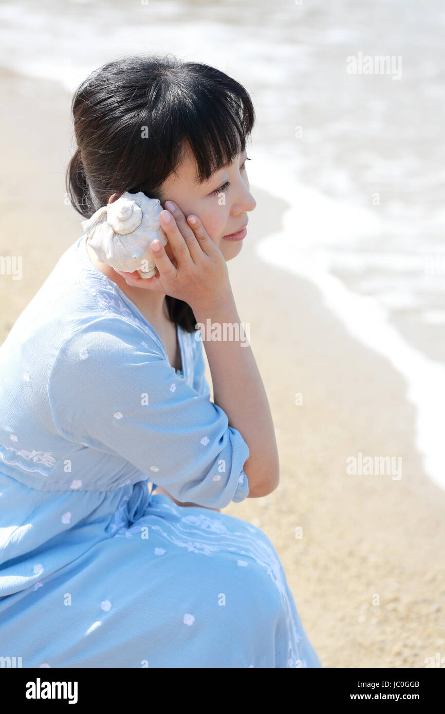 beautiful woman with seashell Stock Photo - Alamy