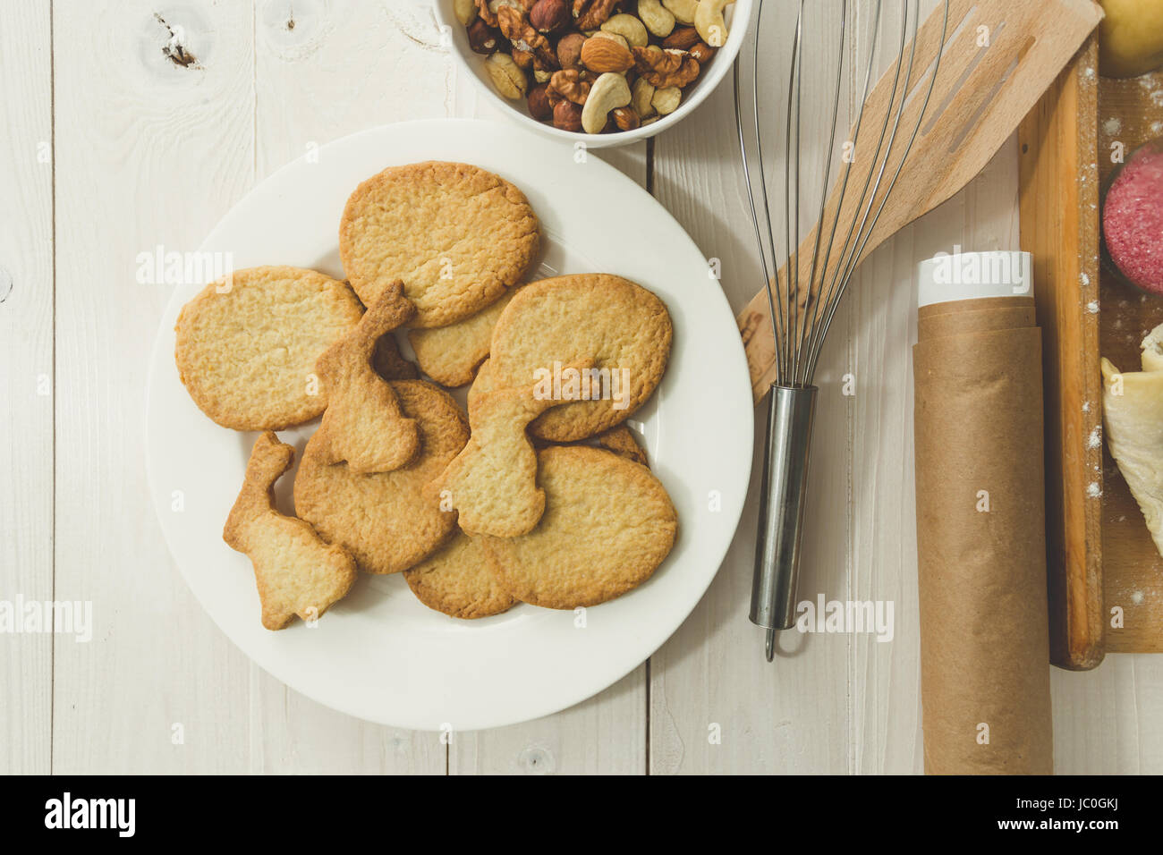 Toned closeup photo of freshly baked cooking next to kitchen utensils ...