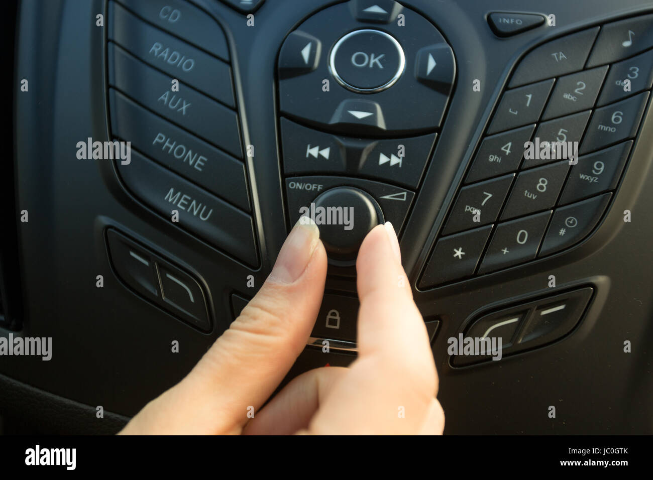 Car radio female hand hi-res stock photography and images - Alamy