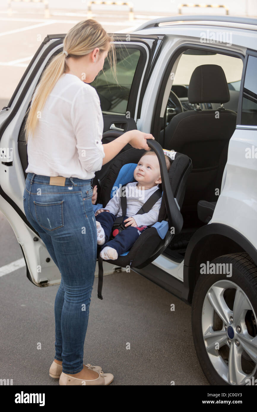 Girl putting seat belt hi-res stock photography and images - Alamy