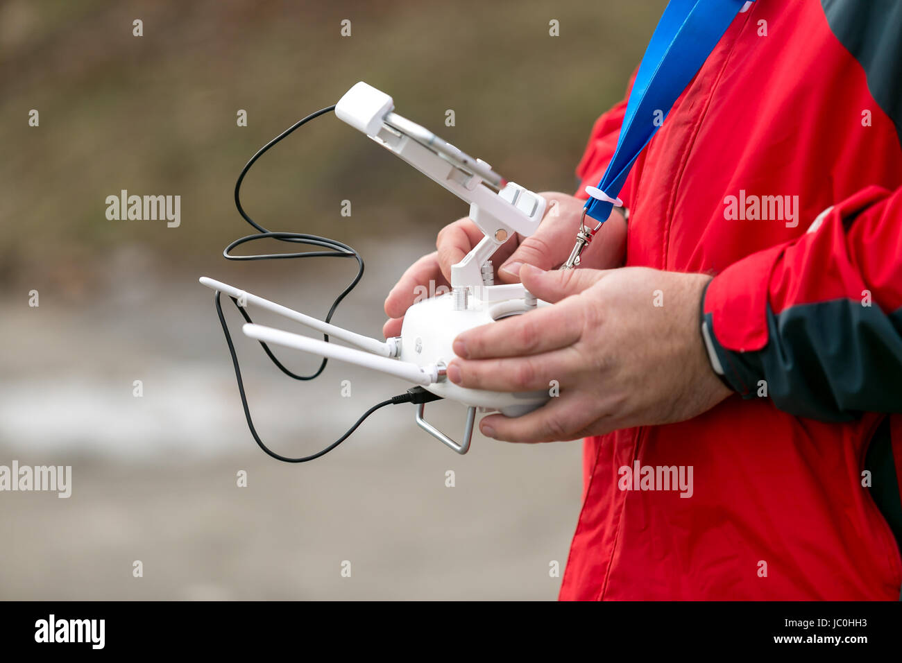 Closeup of man controlling drone from the transmitter outdoors Stock ...
