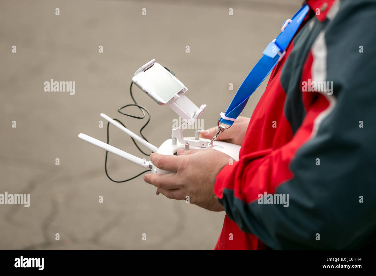 Closeup photo of pilot holding drone remote control Stock Photo - Alamy