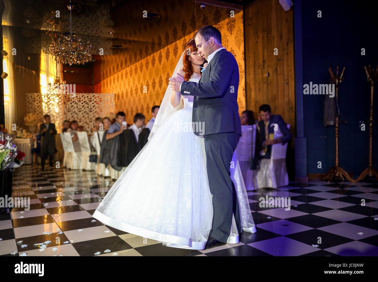 Beautiful bride and groom dancing at restaurant banquet hall Stock ...