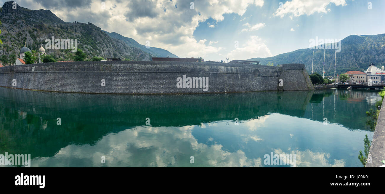 Beautiful panorama of high ancient wall with ditch Stock Photo - Alamy