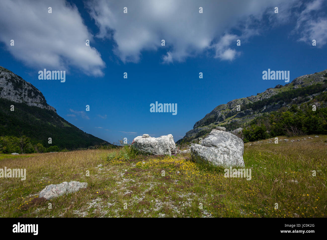Beautiful landscape of valley between two high mountains at sunny day ...