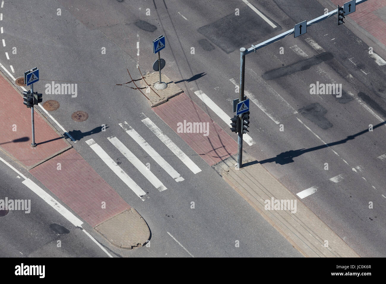 high angle view of an empty street intersection with cross walk ...