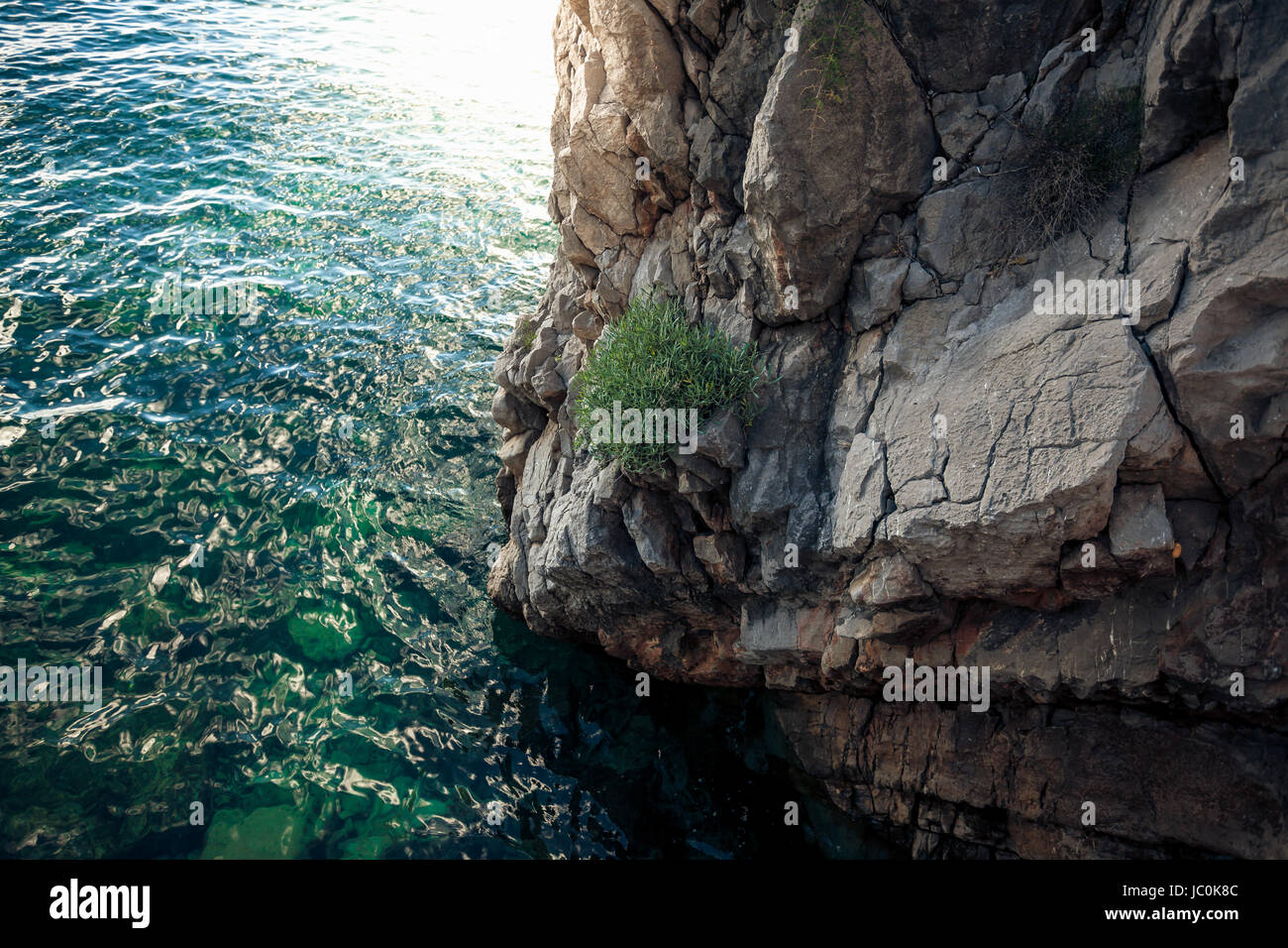 Beautiful view of high cliff in deep blue sea Stock Photo - Alamy