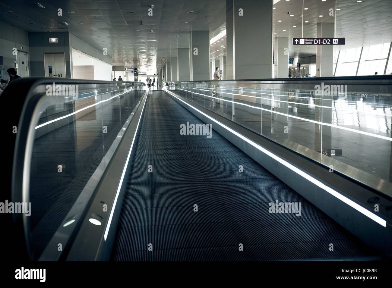 Photo of long horizontal escalator at international airport terminal ...