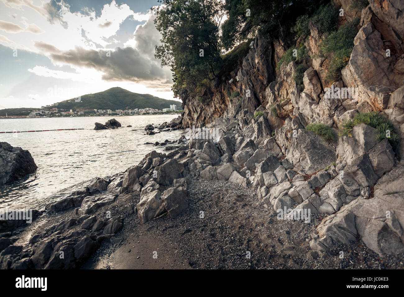 Beautiful high cliff and sea at sunset Stock Photo - Alamy