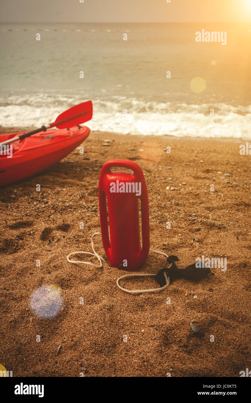 Toned photo of red lifeguard equipment on beach at sunny day Stock ...