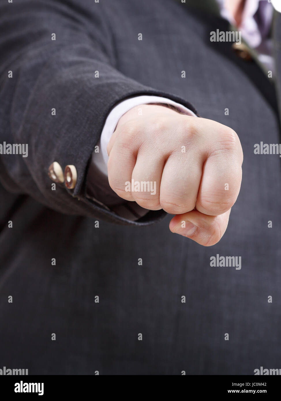 front view of clenched fist of businessman - hand gesture Stock Photo ...