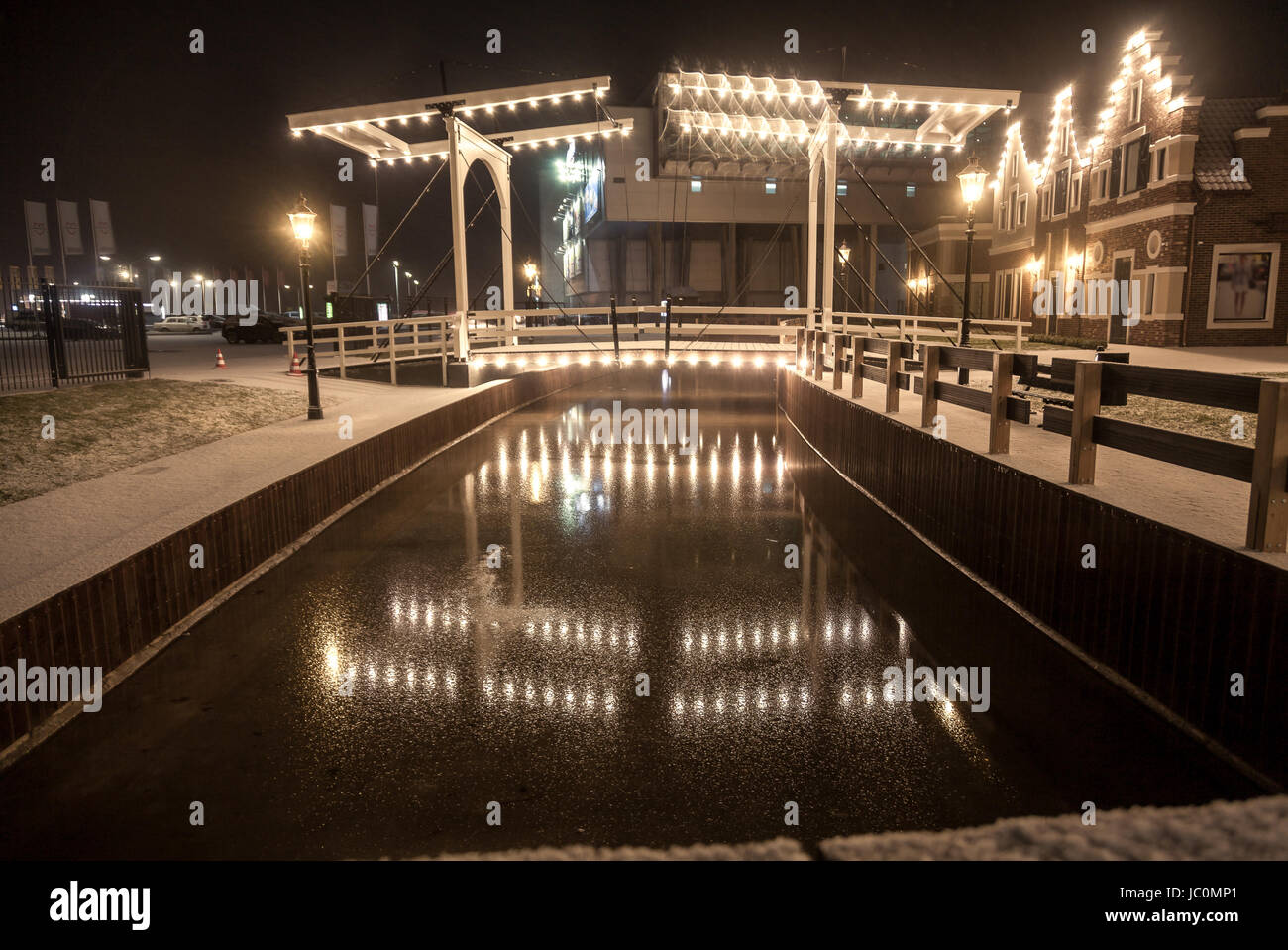 Beautiful view of drawbridge reflecting in water at winter night Stock ...