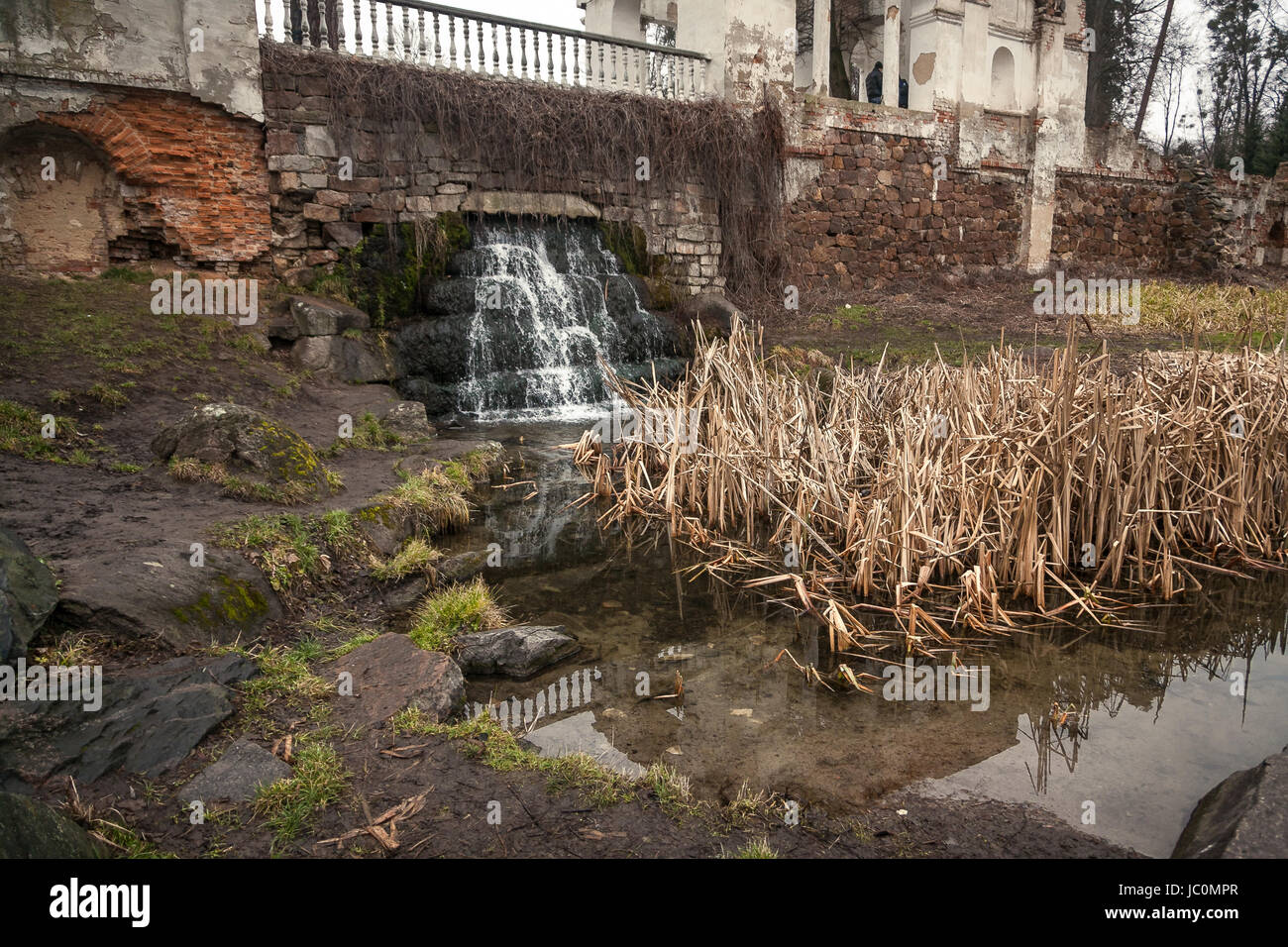 Beautiful landscape of waterfall flowing under old bridge Stock Photo ...