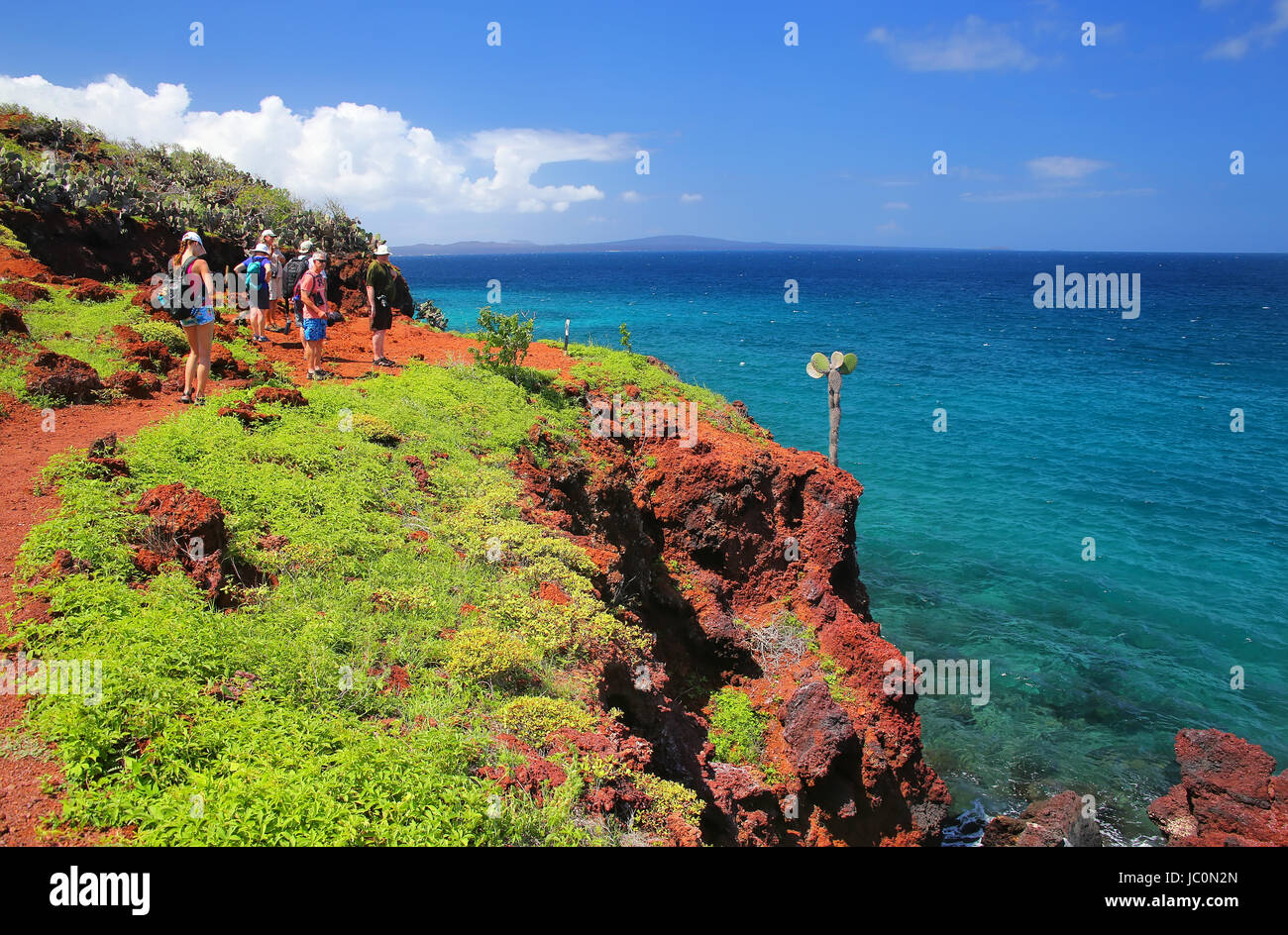 Group of people visiting Rabida Island in Galapagos National Park ...