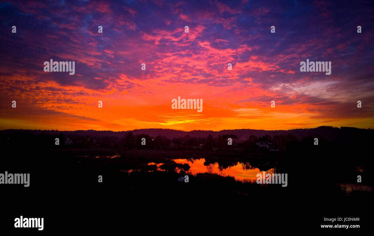 Beautiful sunrise over lake fiery hi-res stock photography and images ...