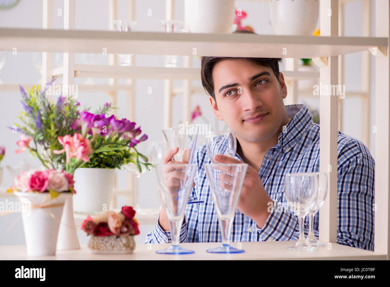 Young handsome man shopping in shop Stock Photo - Alamy