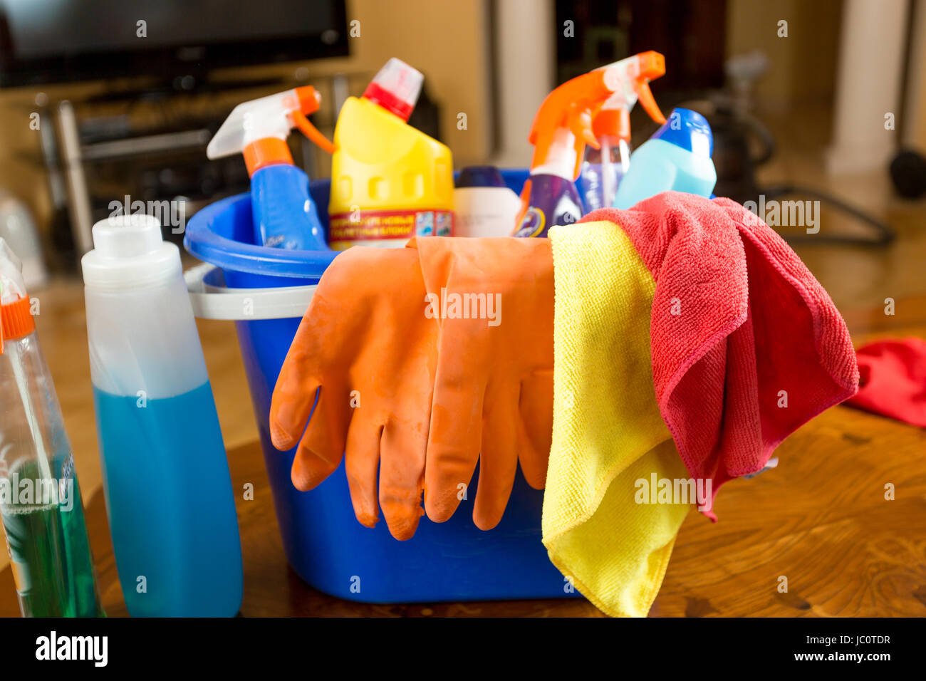 Closeup photo of bucket full of cleaning products at living room Stock ...