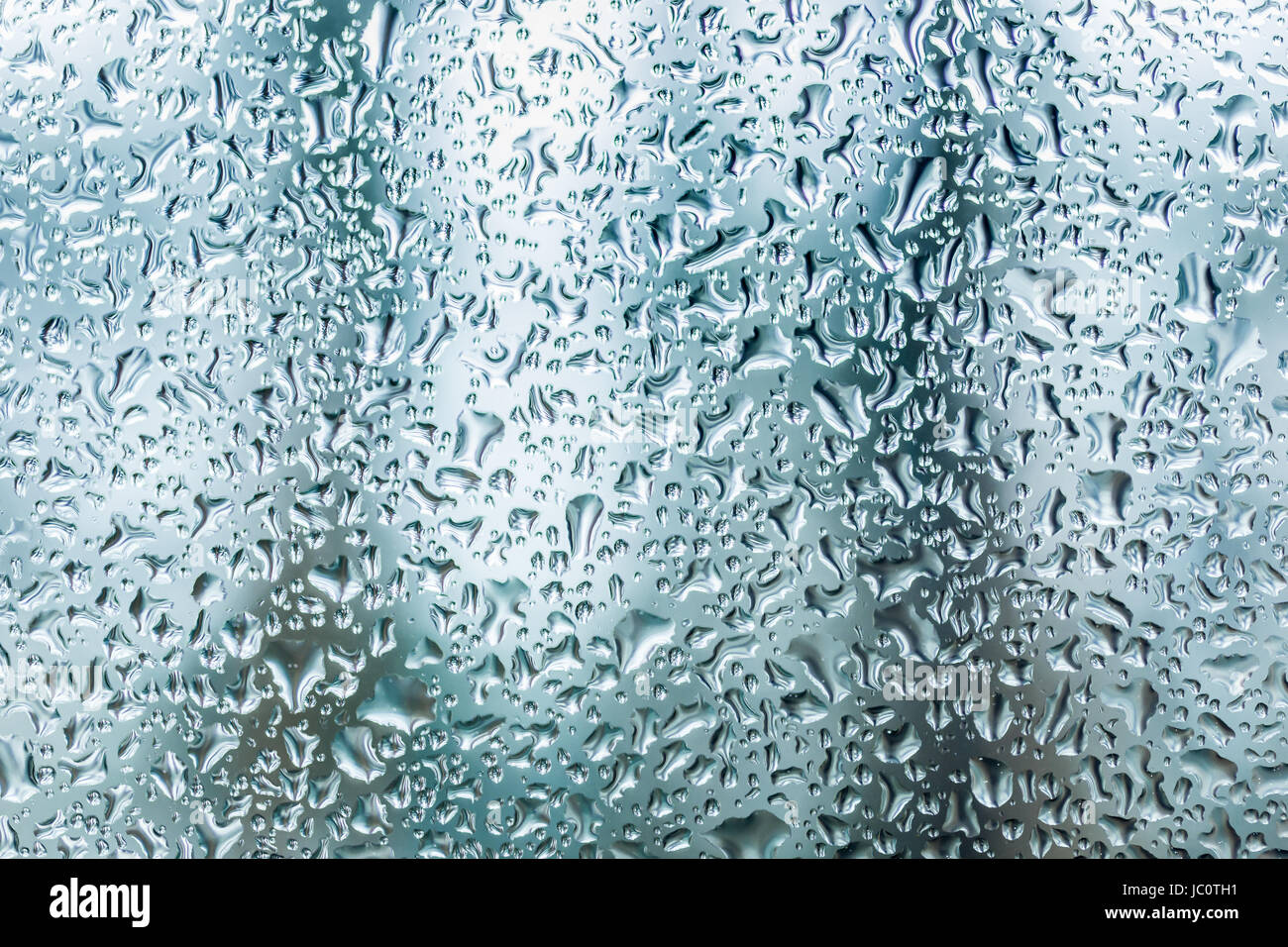Macro texture of glass covered by water drops at rainy day Stock Photo ...