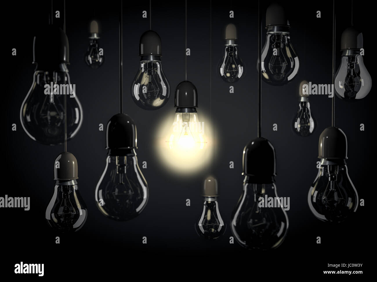 Bulb lighting up room with hanging light bulbs on wires Stock Photo - Alamy