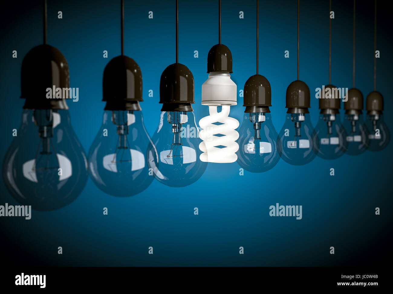 Row of incandescent light bulbs with one energy saving bulb Stock Photo ...