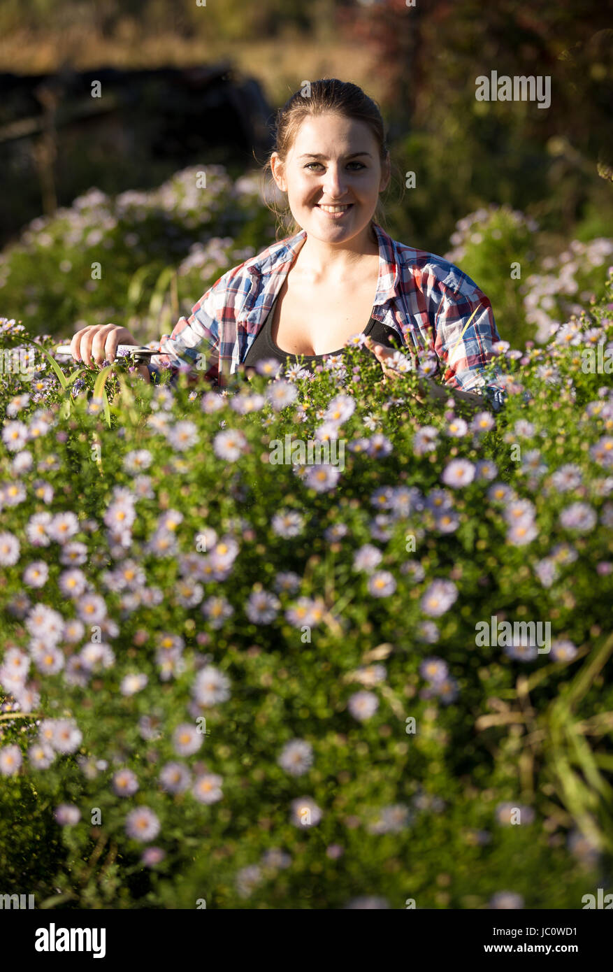 One woman pruning flowers hi-res stock photography and images - Alamy