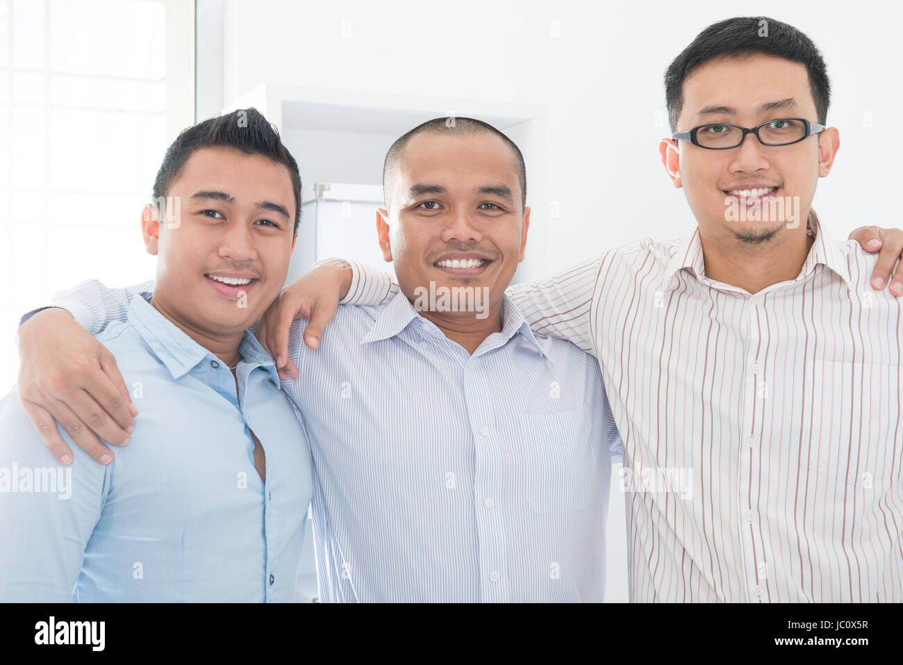 Southeast Asian business team in office Stock Photo - Alamy