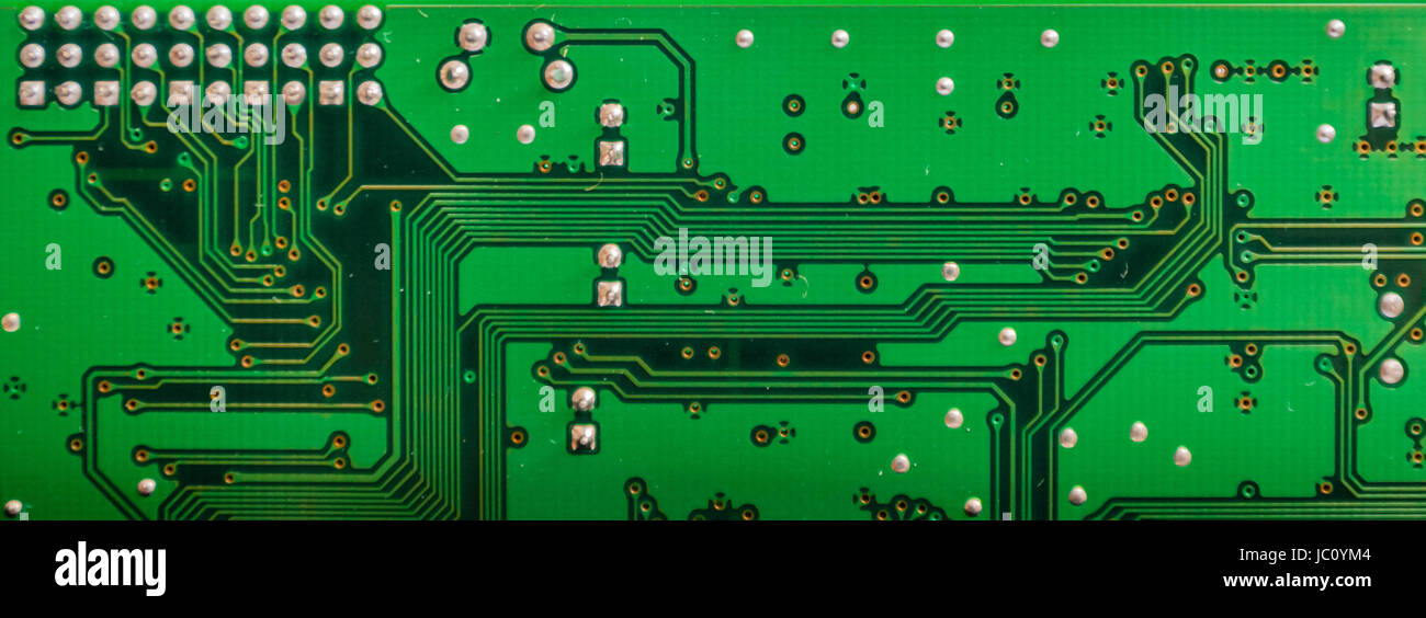 Part of back of green circuit board background Stock Photo - Alamy