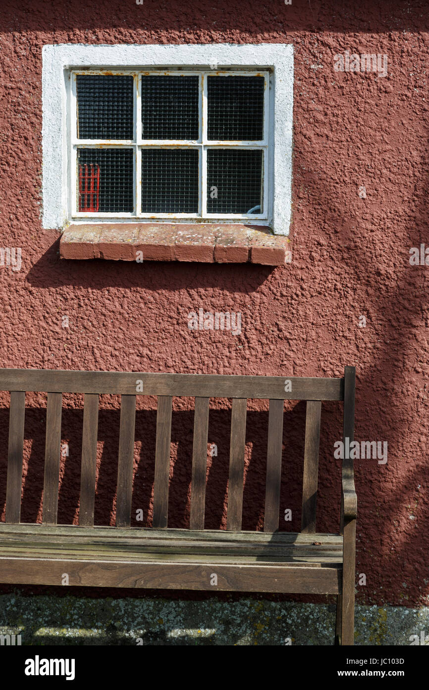 bank under the window Stock Photo - Alamy