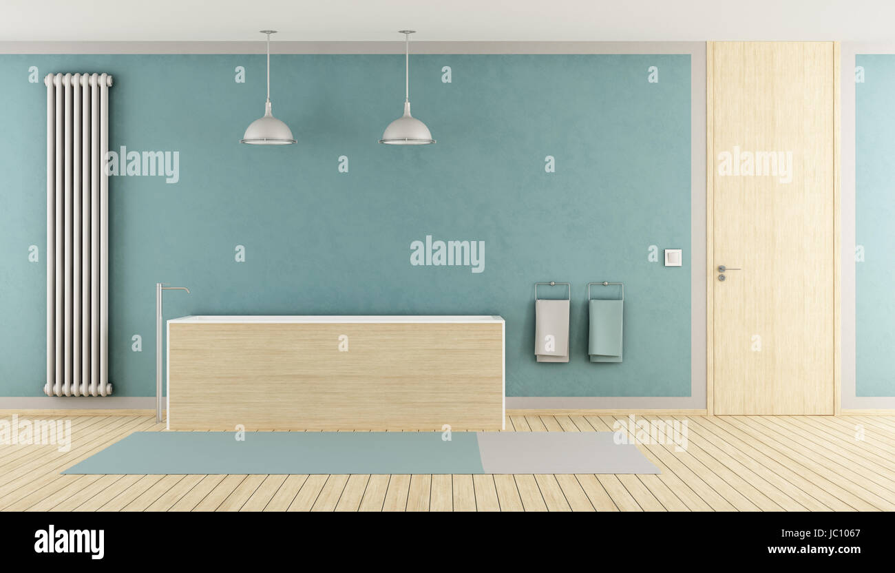 Minimalist blue bathroom with wooden bathtub, radiator and closed door ...