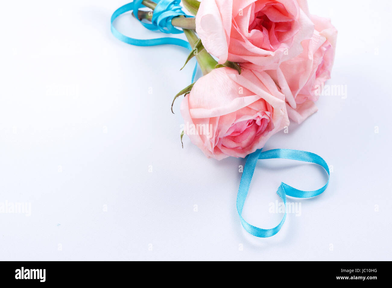 A bouquet of roses with ribbon in heart shape Stock Photo - Alamy