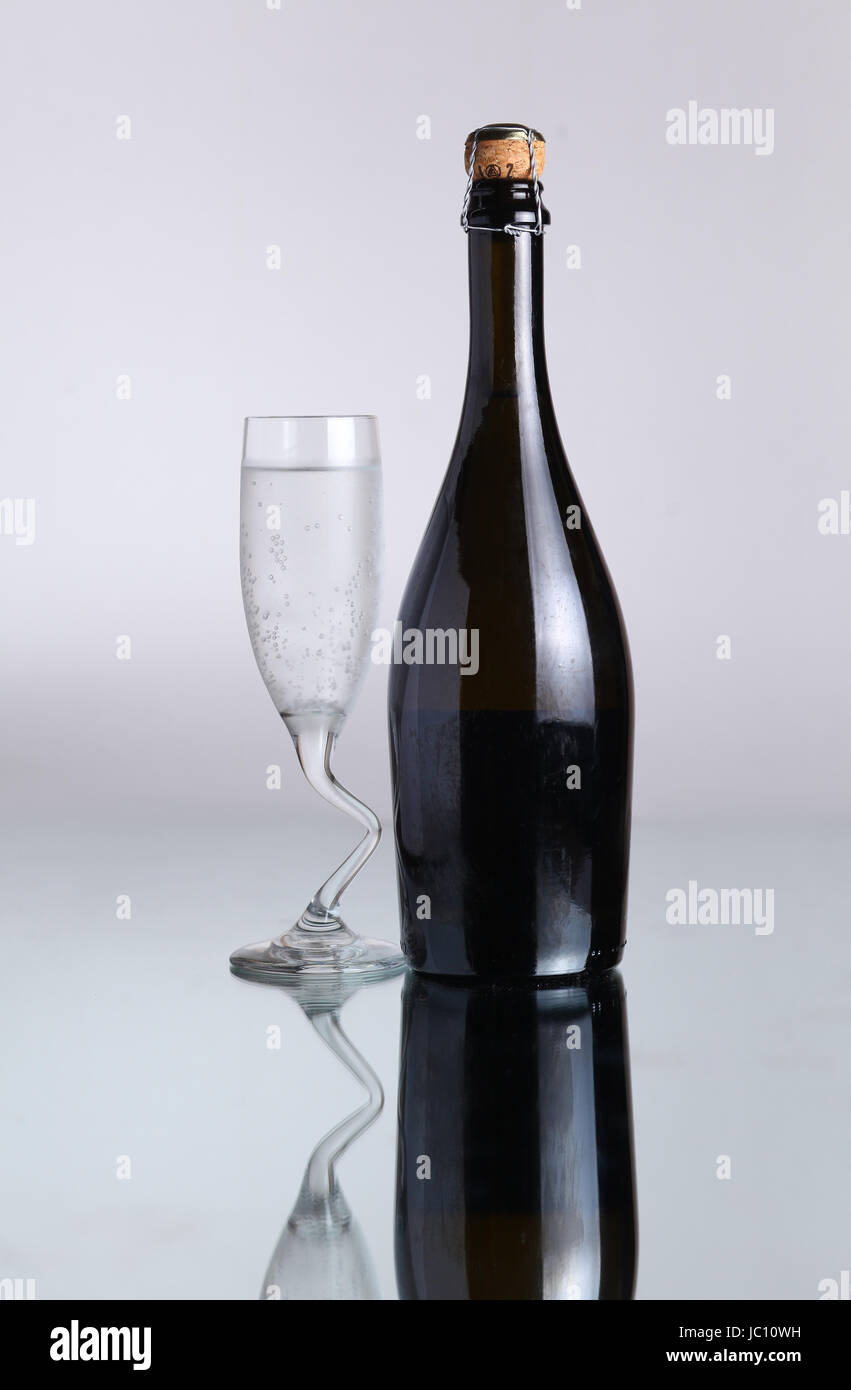 Champagne bottle with chilled class on a smooth light surface Stock ...